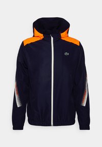 Lacoste Sport TENNIS - Trainingsjacke - navy blue/flashy orange ...