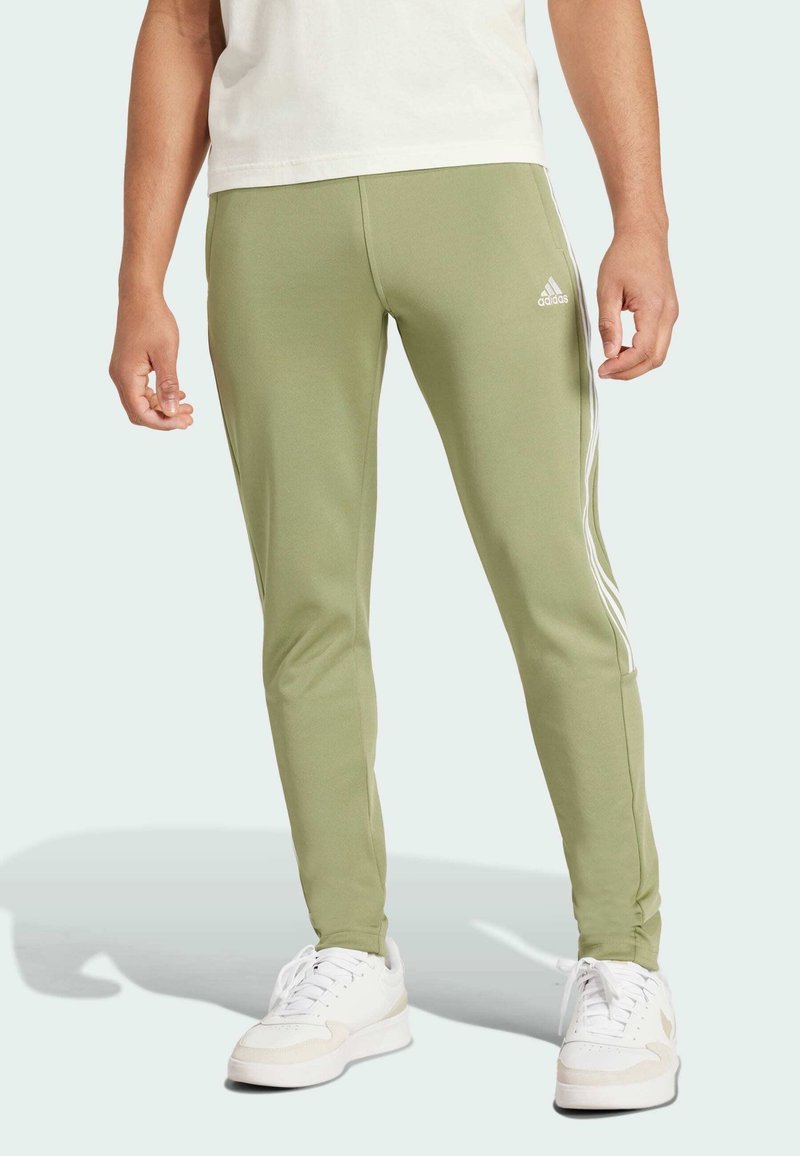 adidas Sportswear TIRO - Tracksuit bottoms - tent green white/green ...