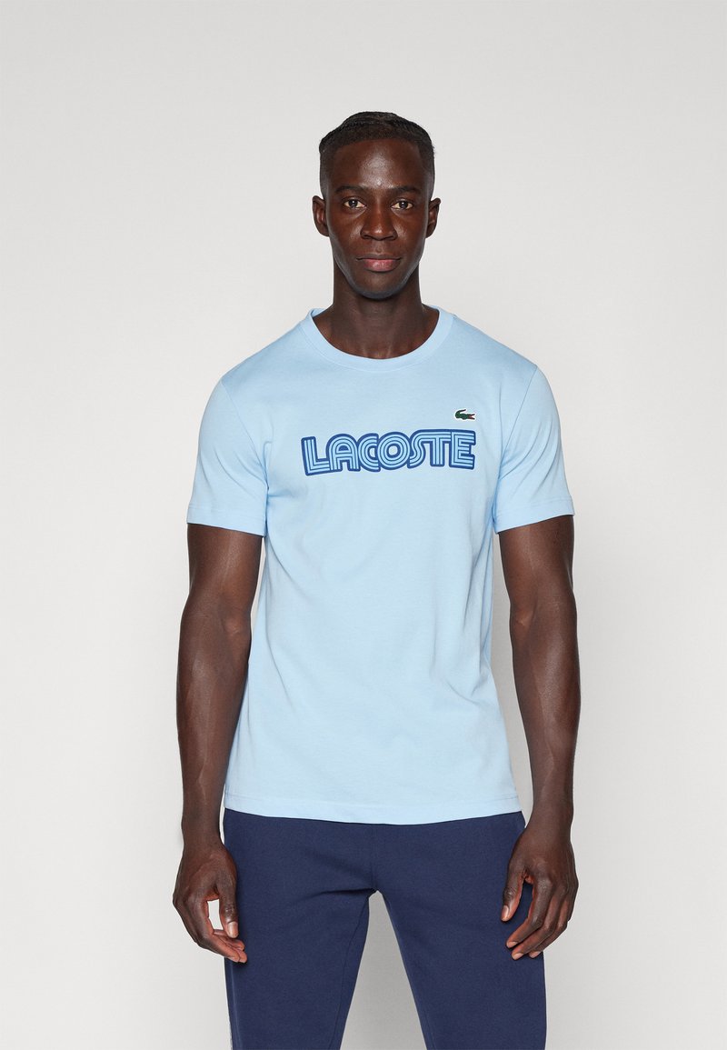 Lacoste Sport TEE TURTLE NECK - Sport T-Shirt - light blue/hellblau ...