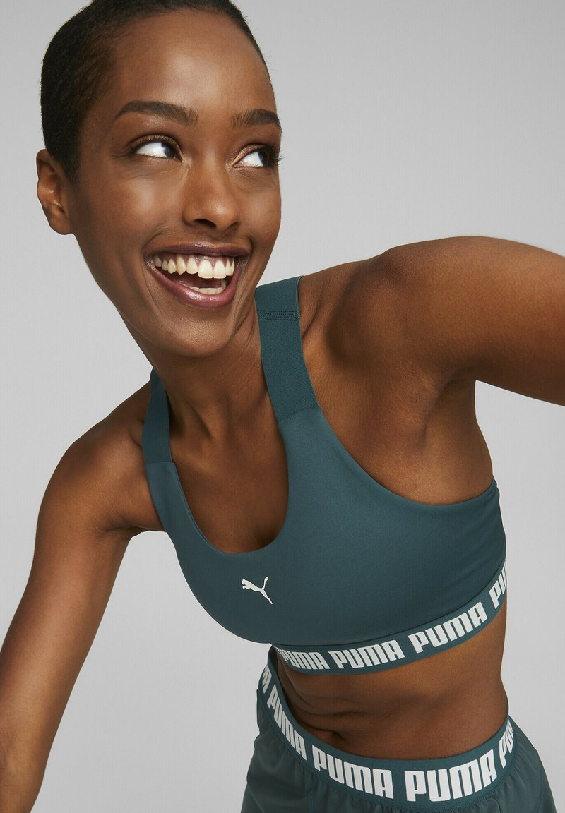 Puma MID IMPACT FEEL IT BRA - Sport-BH mit mittlerer Stützkraft ...