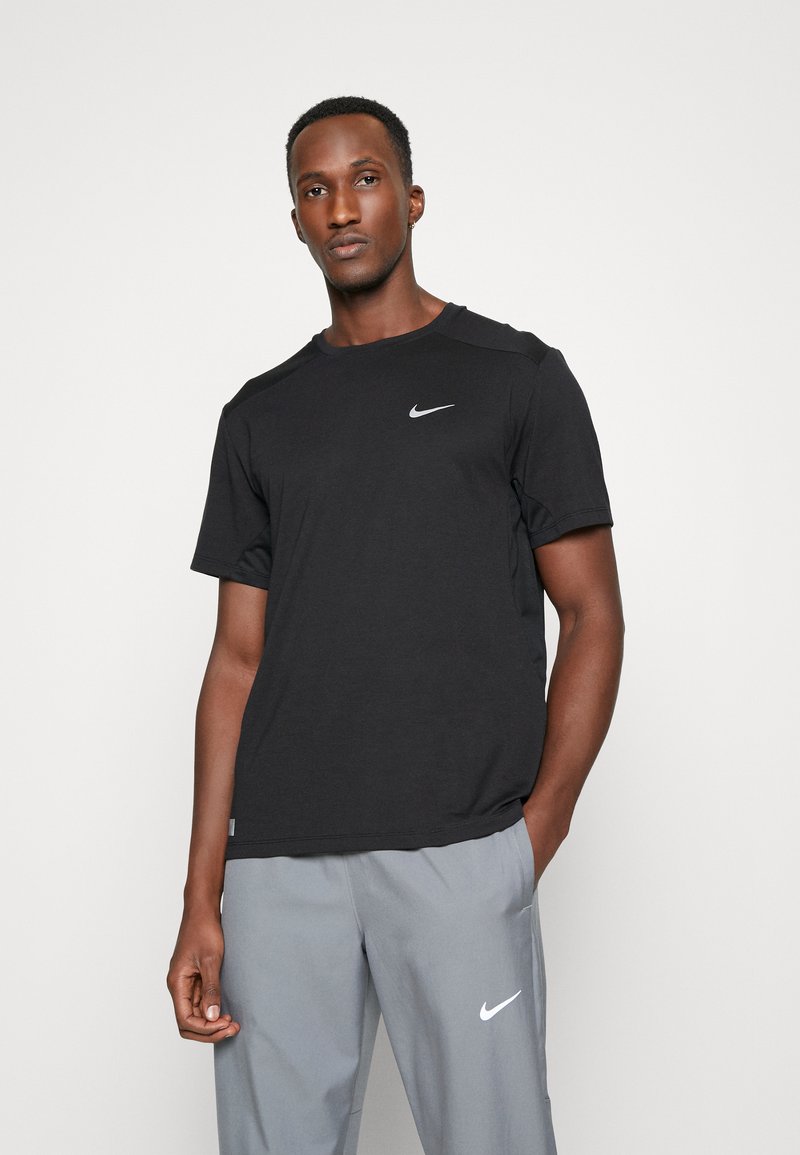 Nike Performance RISE 365 - Sports T-shirts - black/reflective silver ...