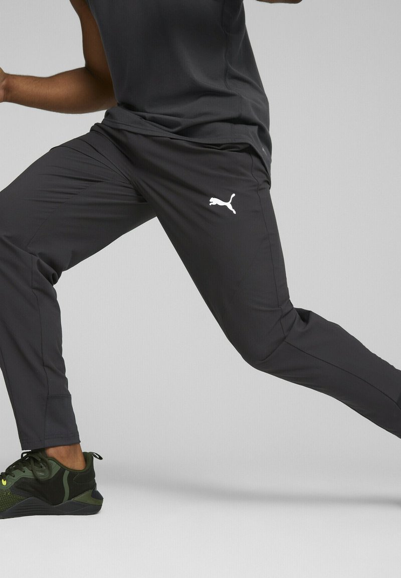 Puma TRAIN ULTRAWEAVE - Jogginghose - black white/schwarz - Zalando.ch