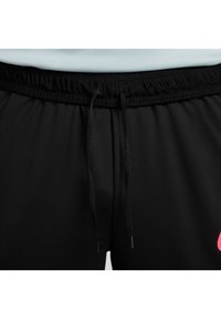 Nike Performance Pantaloni sportivi - black hyper pink hyper pink/nero ...