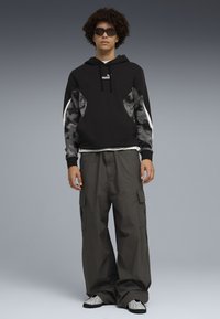 Puma CAMO - Kapuzenpullover - black/schwarz - Zalando.ch