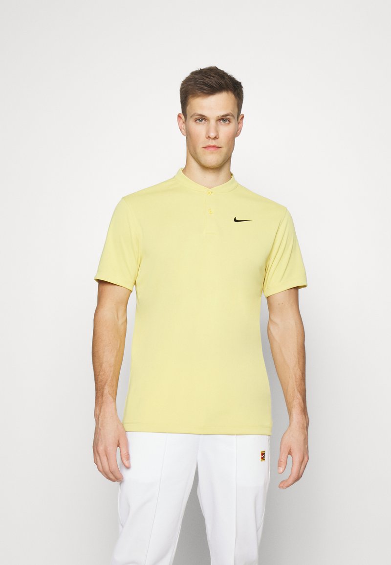 Nike Performance BLADE SOLID - Polo shirt - saturn gold/black/yellow ...
