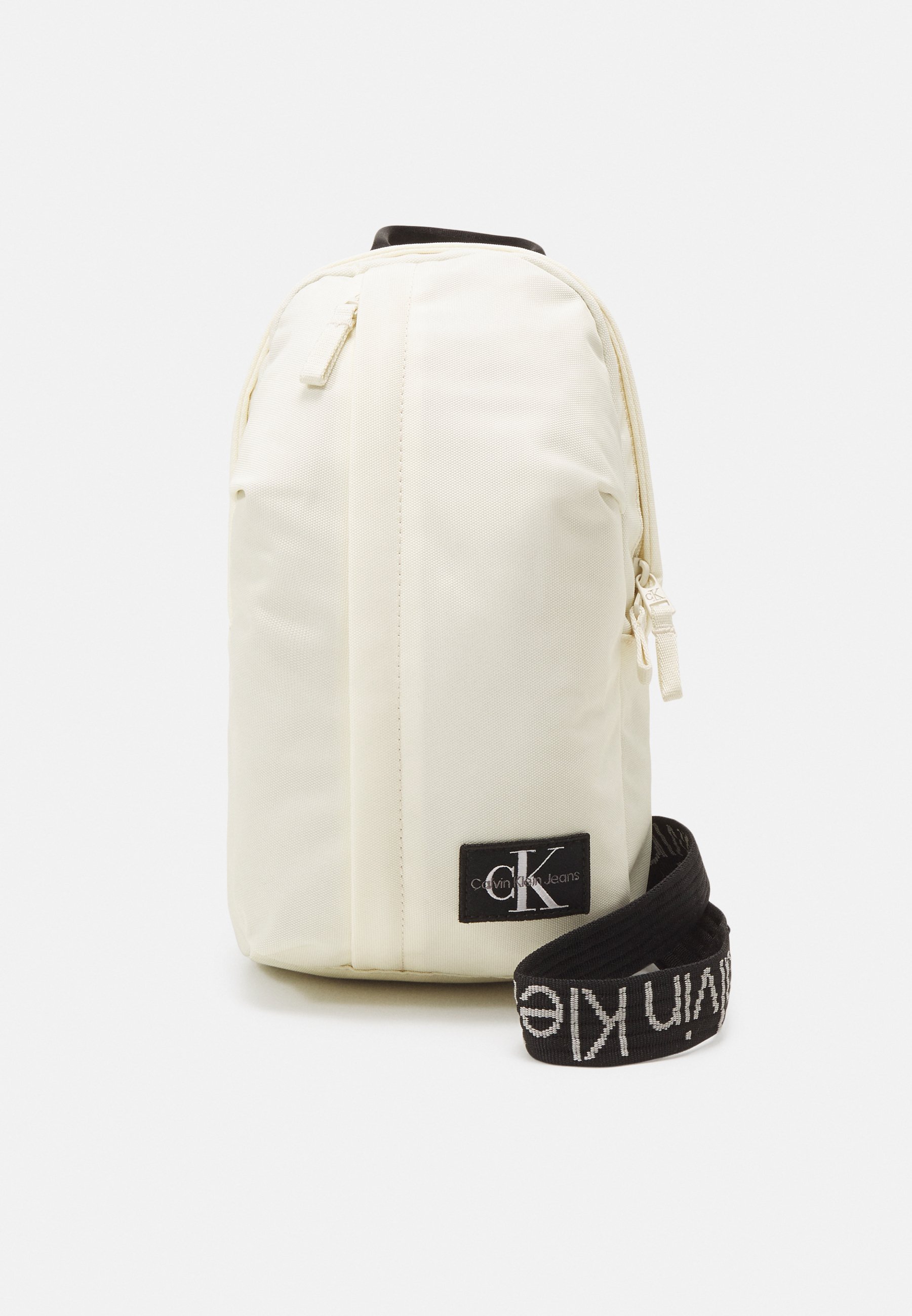 Calvin Klein Jeans LOGO INTARSIA SLINGBAG UNISEX Backpack papyrus light yellow Zalando