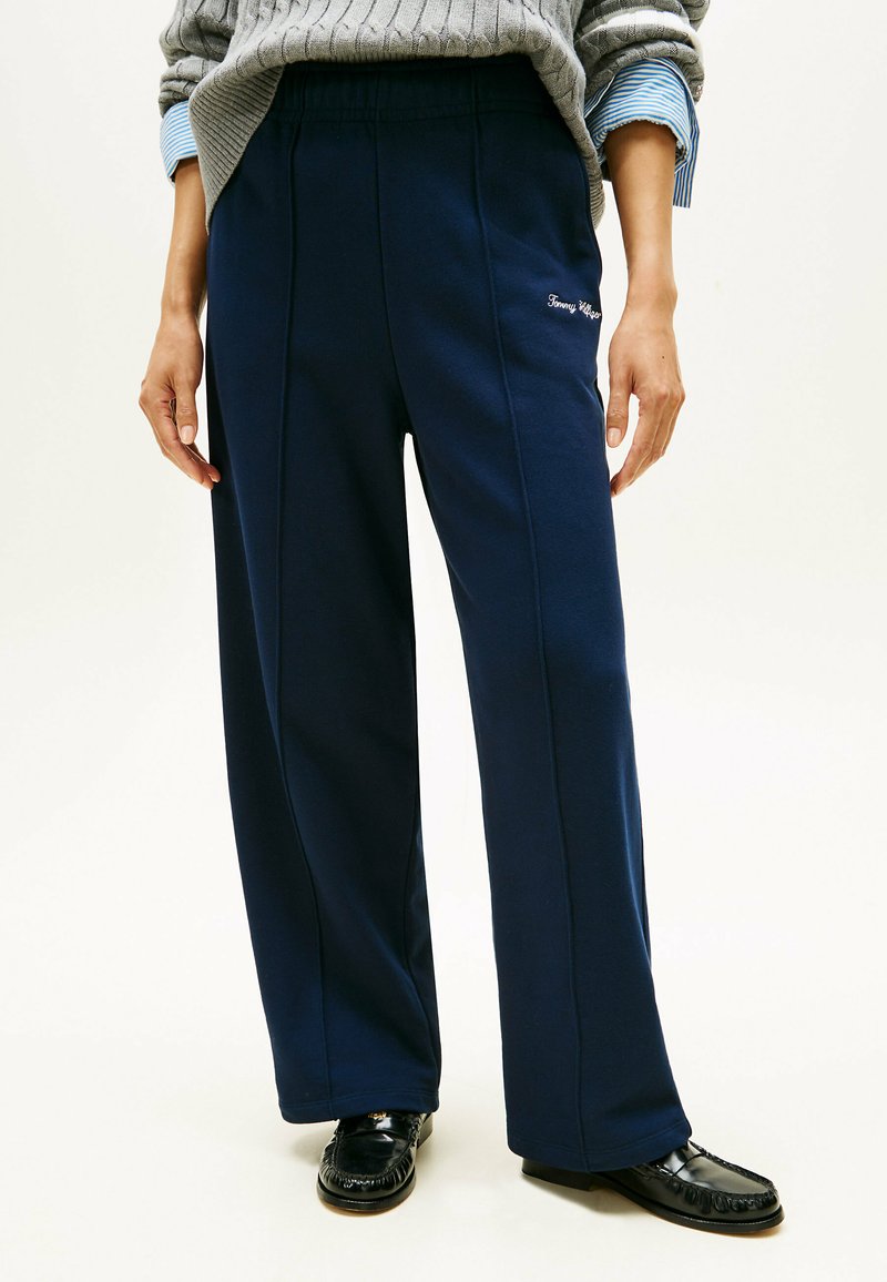 Tommy Hilfiger LOGO EMBROIDERY WIDE - Trousers - dark blue - Zalando