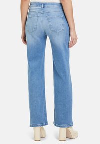 Cartoon MIT EINGRIFFTASCHEN - Jeans Straight Leg - blau - Zalando.ch