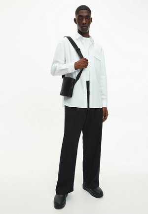 Calvin Klein SMALL - Umhängetasche - dull gold/goldfarben - Zalando.ch