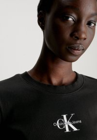 Calvin Klein Jeans MONOLOGO - T-Shirt print - ck black/schwarz - Zalando.at