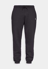 Timberland NEW BADGE SWEATPANT - Tracksuit bottoms - black - Zalando.ie