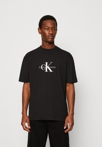 Calvin Klein Jeans MONOLOGO TEE UNISEX - T-Shirt print - black/schwarz - Zalando.at