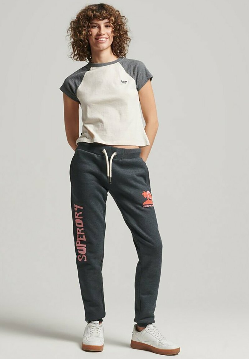 Superdry VINTAGE CALI CUT OUT JOGGERS - Trainingsbroek - jet black marl ...