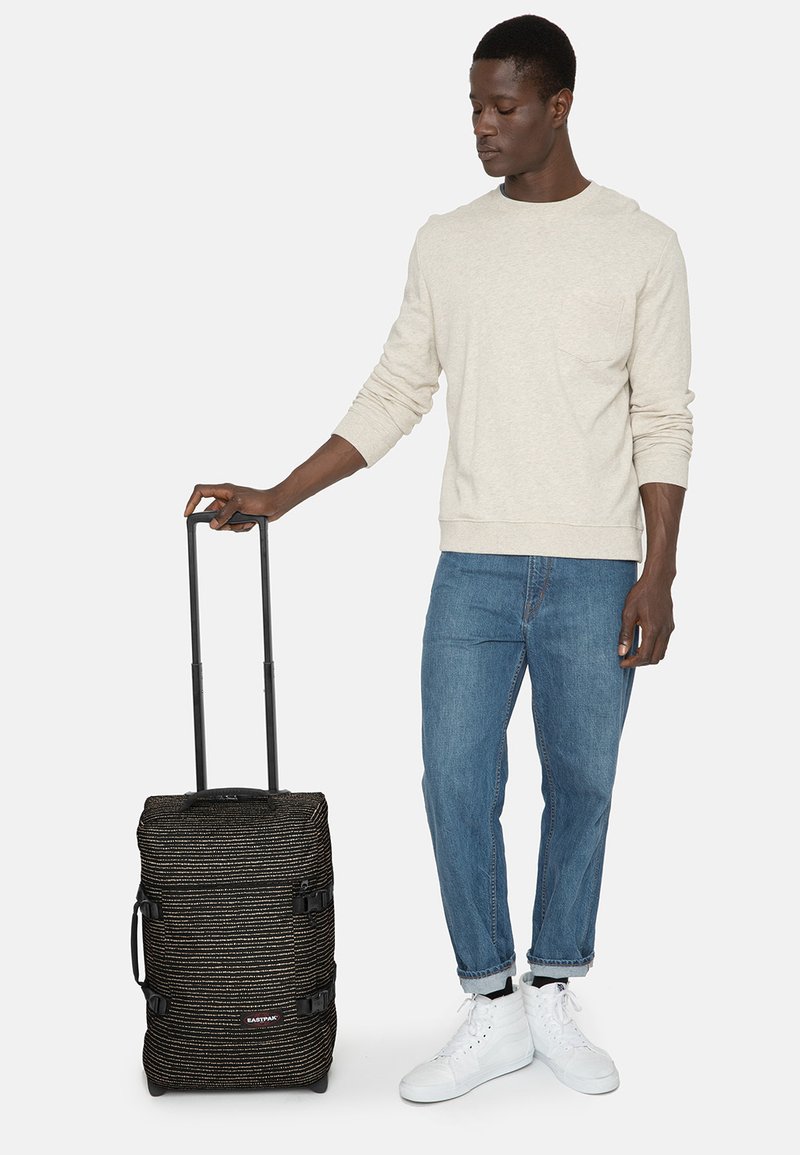 Eastpak TWINKLE - Wheeled suitcase - gold/black - Zalando.co.uk