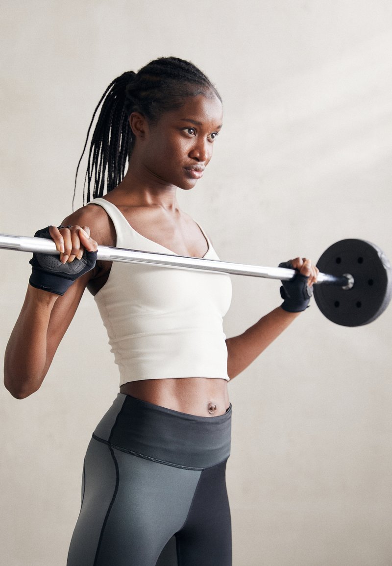 Nike Performance ALATE BRA TANK - Medium support sports bra - light ...