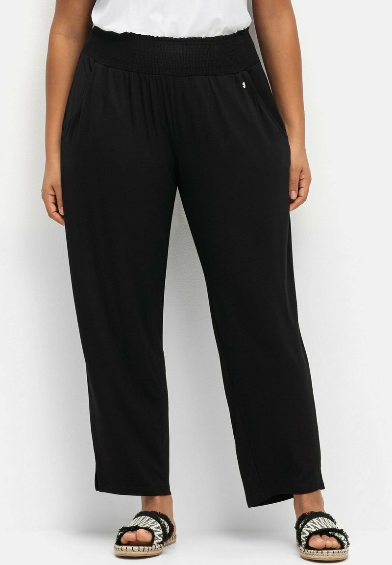 Sheego Tracksuit bottoms - schwarz/black - Zalando.de