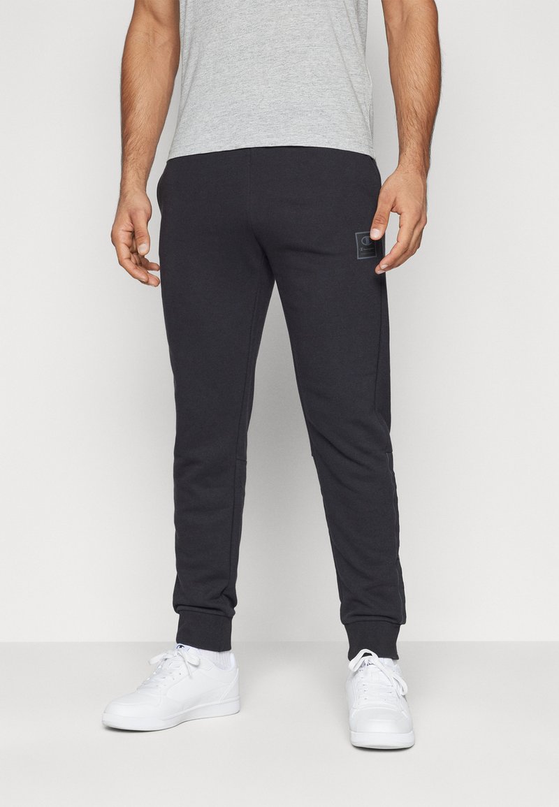 Champion ATHLEISURE CUFF PANTS - Tracksuit bottoms - black - Zalando.ie