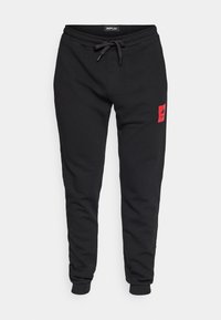 Replay PANTS - Tracksuit bottoms - black - Zalando.ie