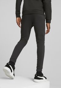 Puma TECH - Trainingsbroek - black/zwart - Zalando.nl