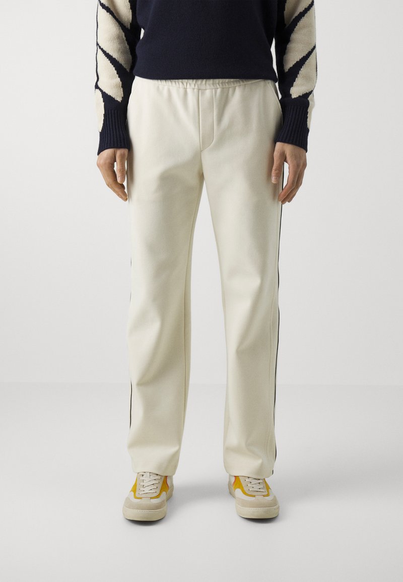 MCM ESSENTIAL - Tracksuit bottoms - ivory/off-white - Zalando.co.uk