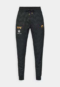 Venum UFC ZENITH FIGHT NIGHT MENS JOGGER - Tracksuit bottoms - black ...