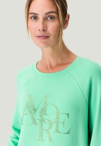zero MIT GLITZERSTEINCHEN - Sweatshirt - patch greengreen/grün - Zalando.de