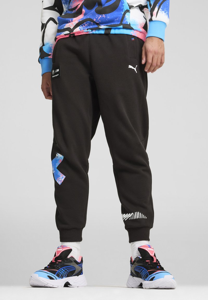 Puma NEON ENERGY - Spodnie treningowe/czarny - Zalando.pl