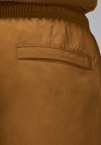 Jordan Trainingsbroek - desert bronze/brons - Zalando.nl