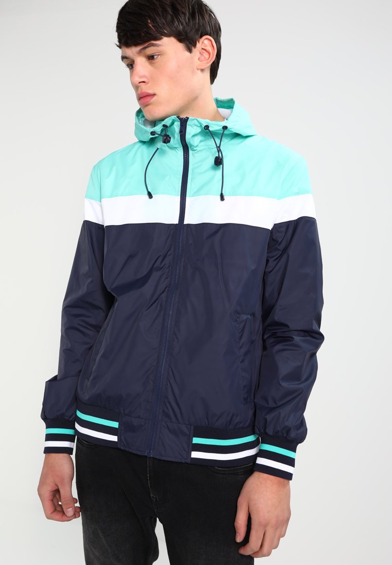 Urban Classics HOODED COLLEGE WINDBREAKER - Leichte Jacke - navy/mint ...