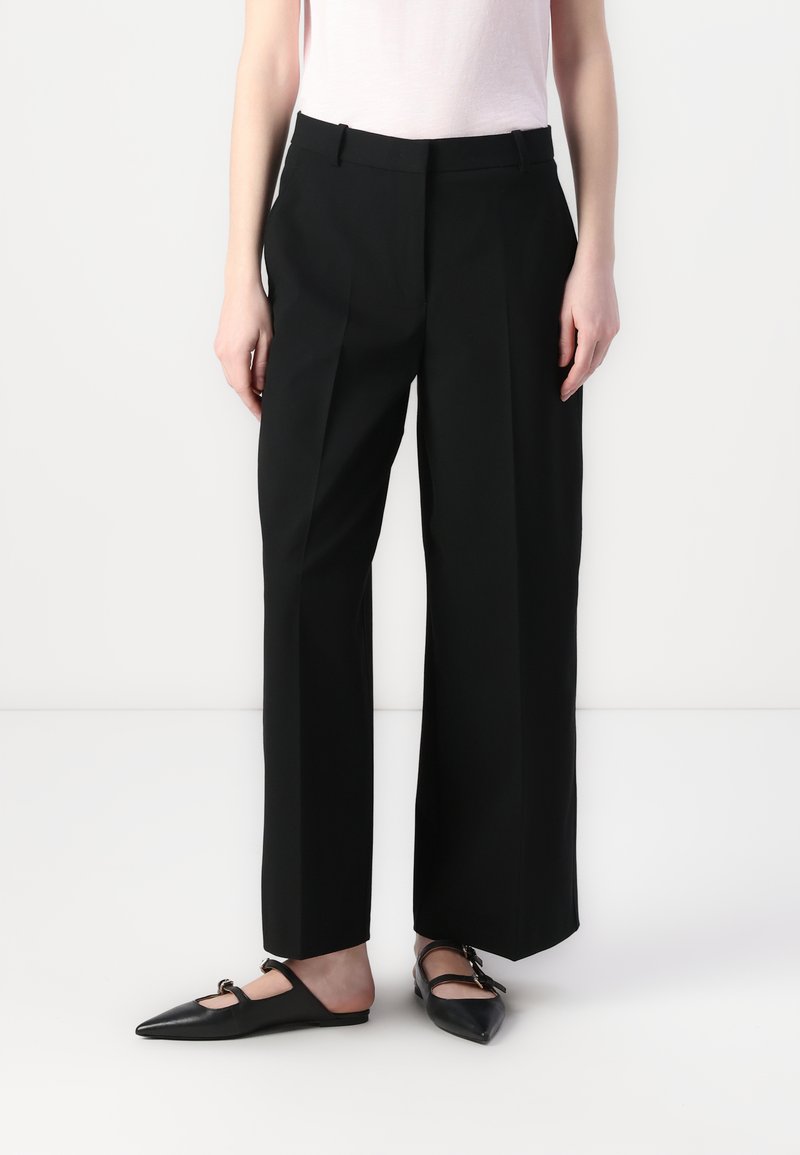 Tommy Hilfiger STRETCH WIDE LEG PANT - Stoffhose - black/schwarz ...