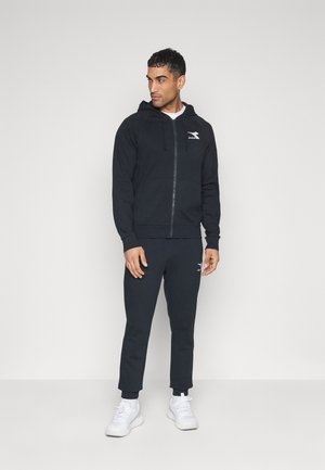 Karl Kani ESSENTIAL TRACKSUIT SET UNISEX - Trainingsanzug - black ...
