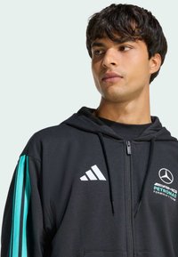 adidas Performance National team wear - black semi mint rush/black ...