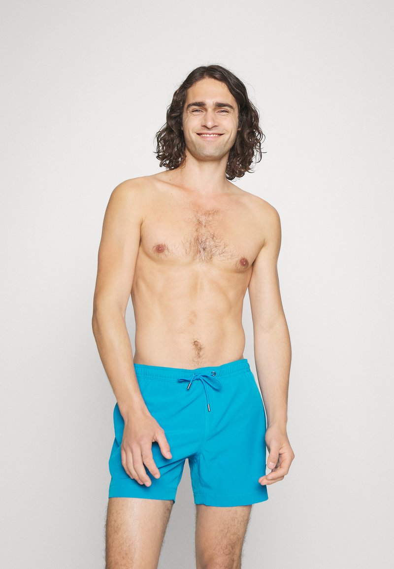 Michael Kors TRUNK SOLID MEDALION - Swimming shorts - brtcyan blue/blue ...