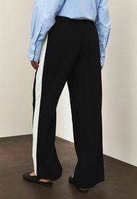 Next TALL FIT - SIDE STRIPE WIDE LEG TAILORED - Tracksuit bottoms ...