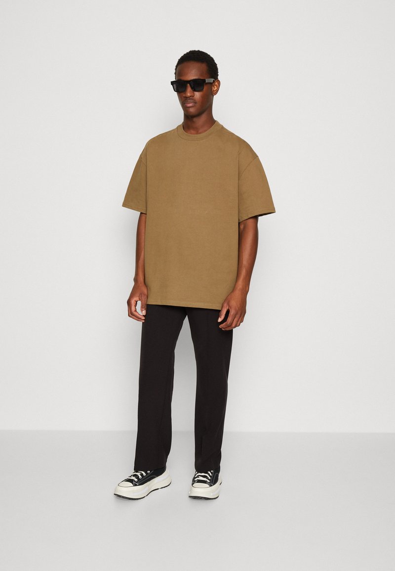 Weekday KEN TRACKPANTS UNISEX - Trousers - black - Zalando.ie