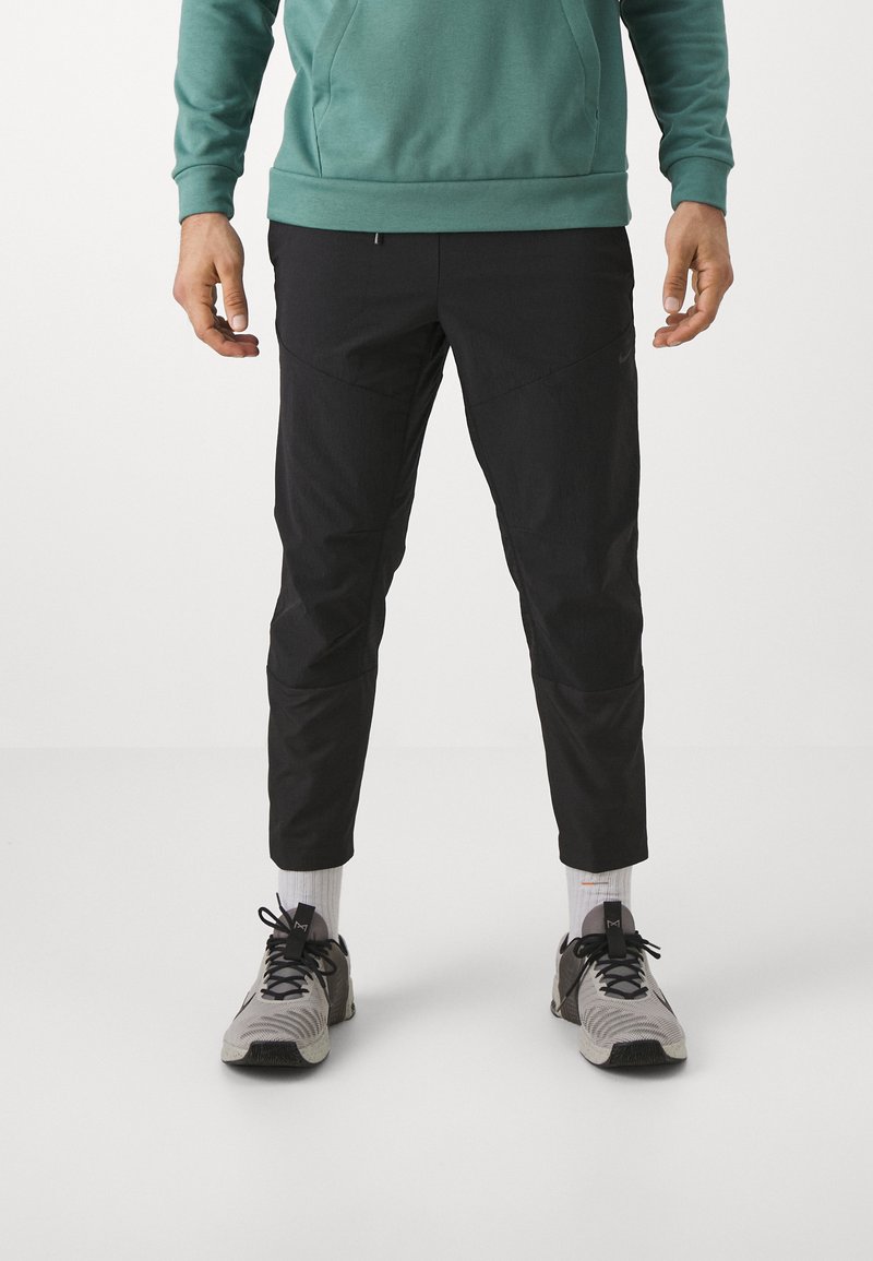 Nike Performance AXIS PANT - Trainingsbroek - black/zwart - Zalando.nl