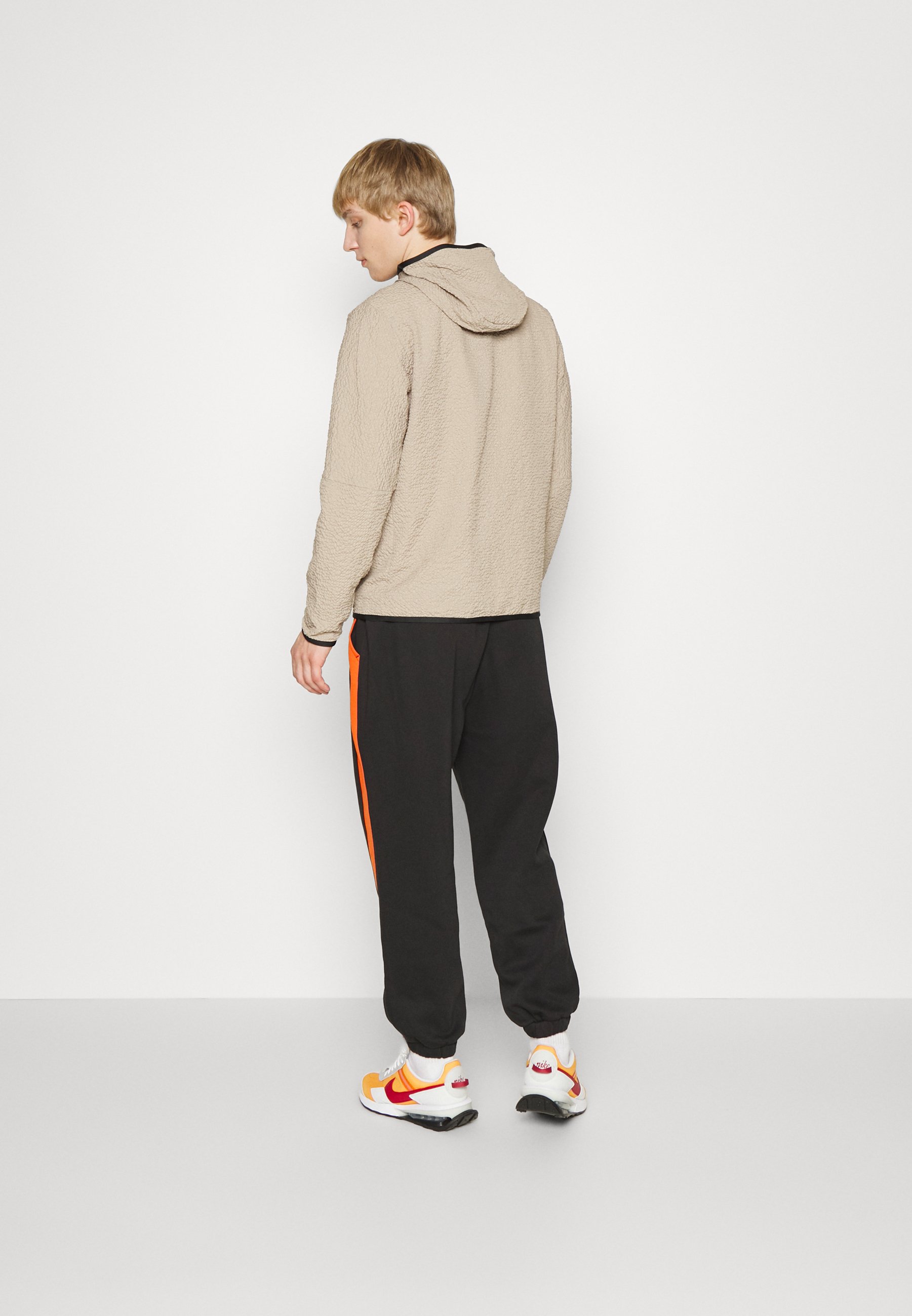 Calvin Klein Jeans STACKED PANT Tracksuit bottoms black coral orange black Zalando