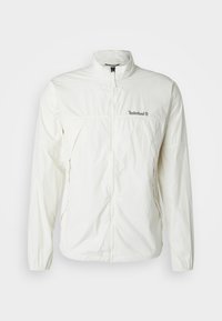 Timberland JENNESS ANTI UV WINDPROOF JACKET - Windjack - vintage white ...