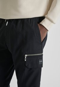 Antony Morato TONY REGULAR FIT WITH LOGOED BADGE - Cargo trousers ...