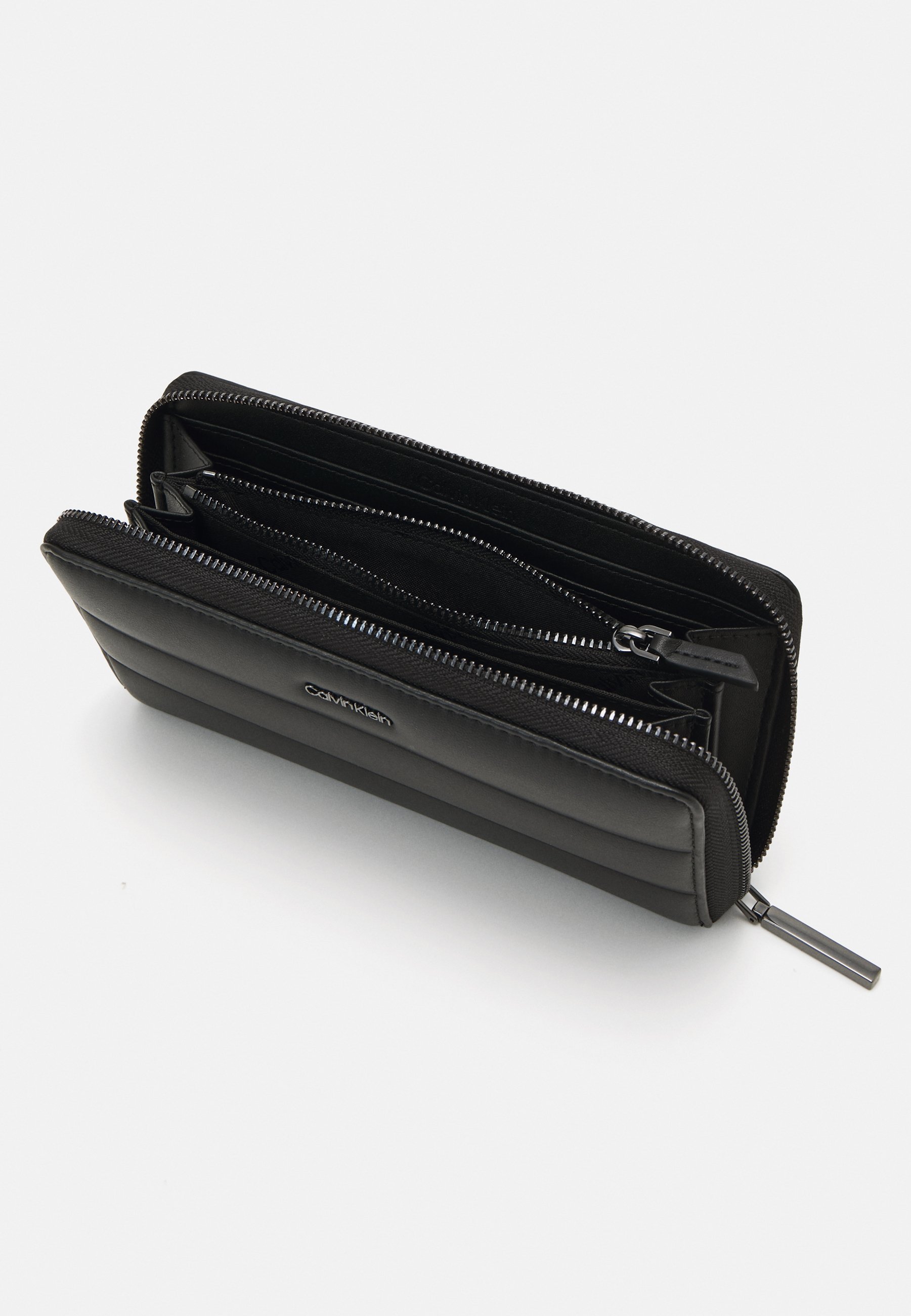 Calvin Klein LINE QUILT LARGE ZIP AROUND Wallet black Zalando