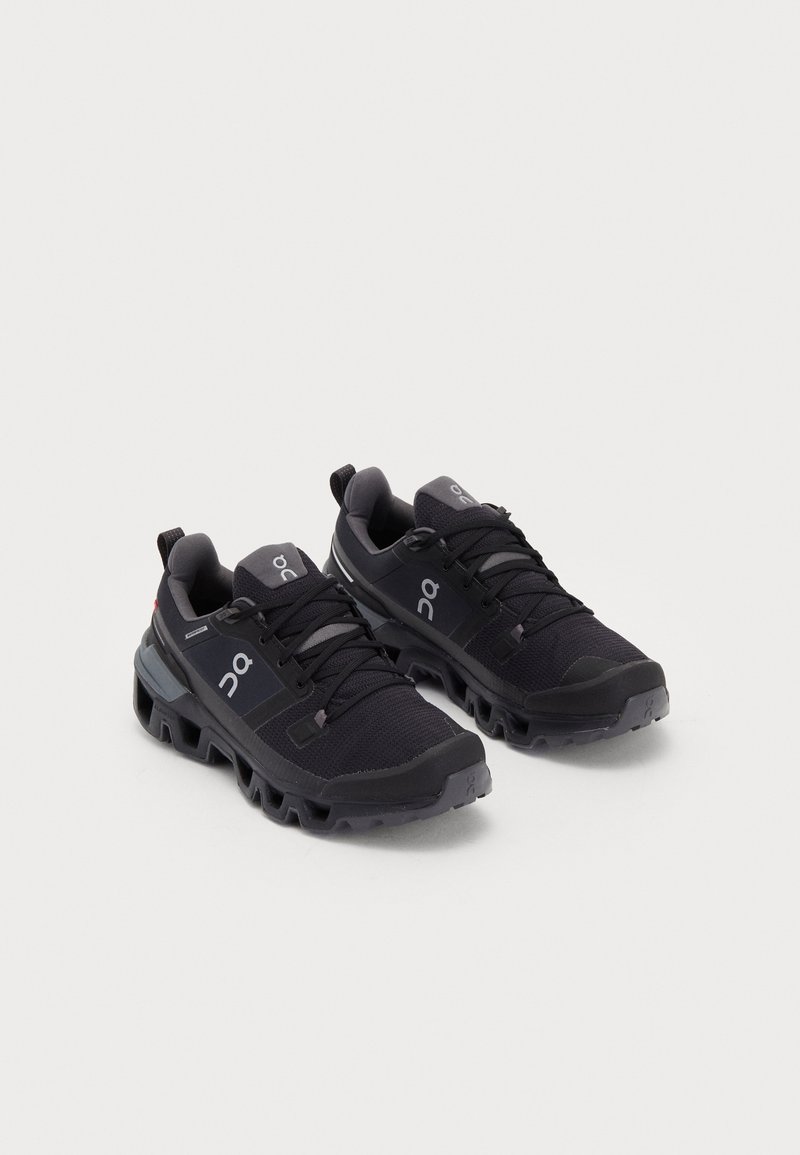 On CLOUDWANDER WATERPROOF - Walking shoes - black eclipse/black - Zalando