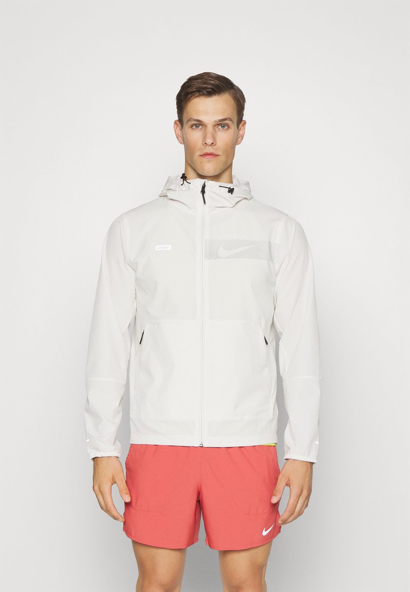 Nike Performance UNLIMITED - Running jacket - phantom/silver/dark grey ...
