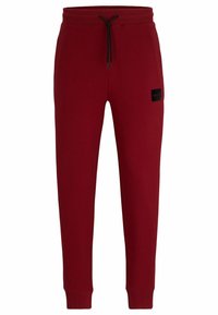 HUGO Tracksuit bottoms - dark red - (Pre-owned) - Zalando