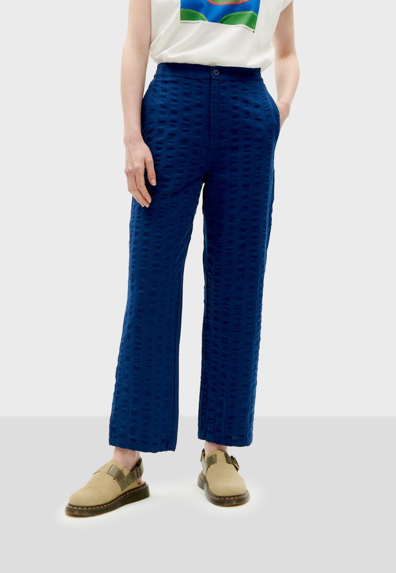 Thinking Mu Spodnie materiałowe - Zalando.pl