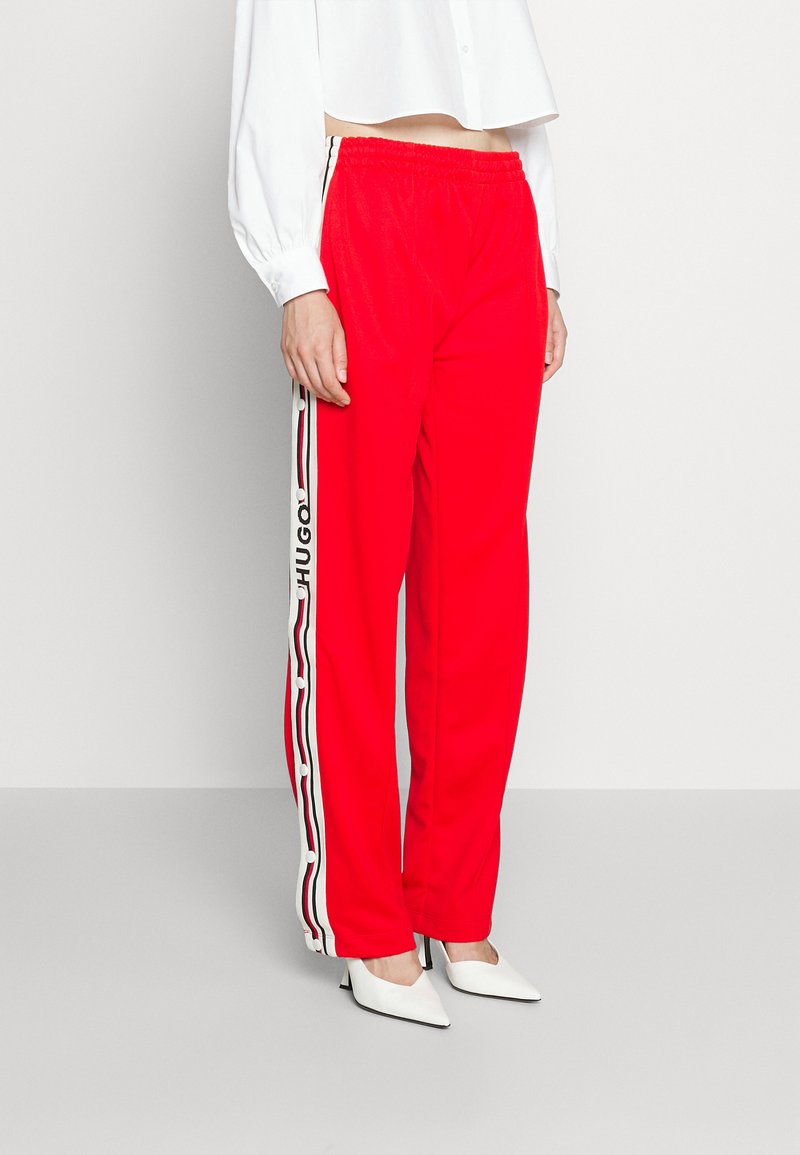 HUGO NALUISE - Tracksuit bottoms - red - Zalando.co.uk