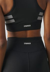 Stronger AMAZE - Sport-BH mit starker Stützkraft - black/schwarz ...