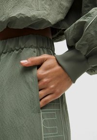 lululemon Crinkle Mid-Rise Wordmark - Trousers - willow leaf fog green ...