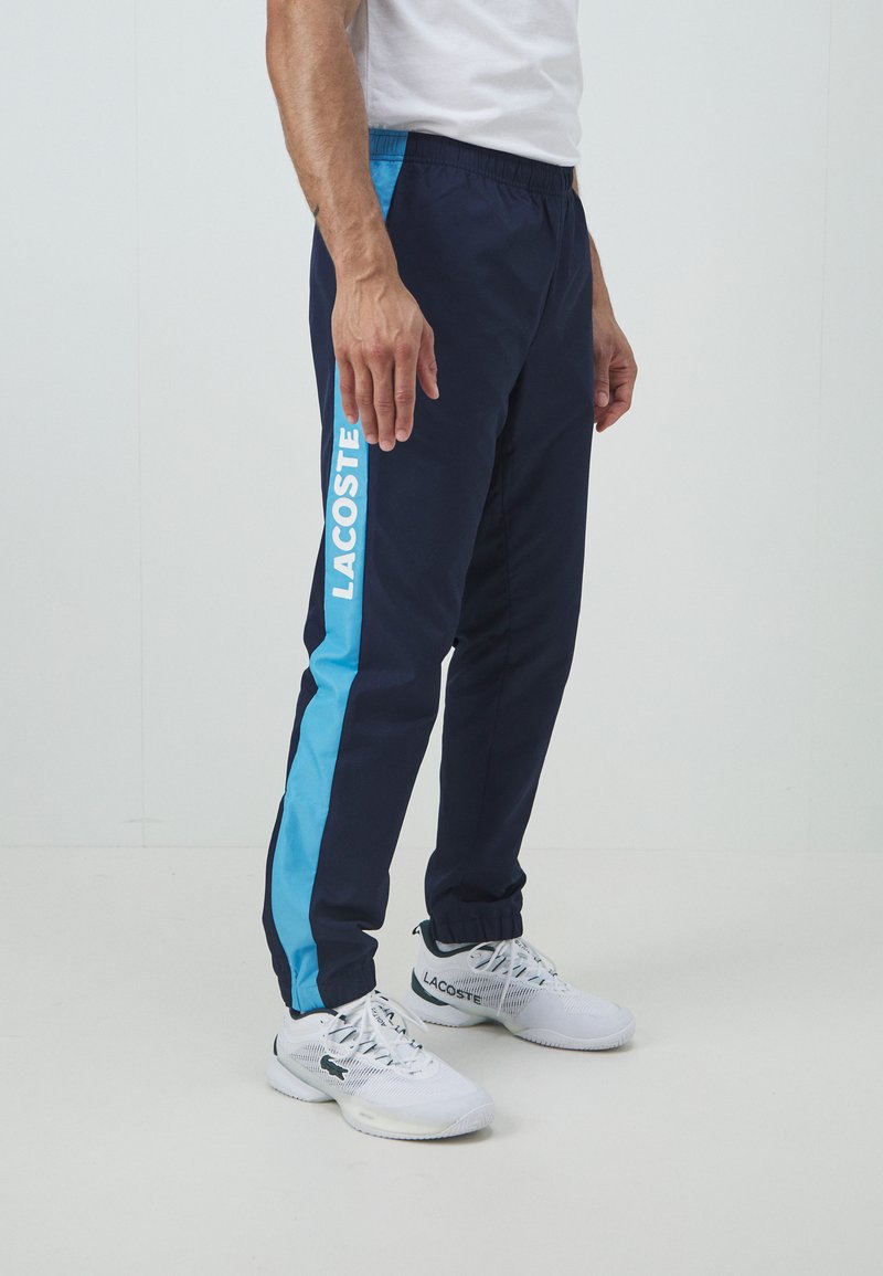 Lacoste Sport TROUSERS - Pantalon de survêtement - navy blue/bonnie ...