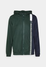 Lacoste Sport Tréning dzseki - vert/bleu marine/blanc/sötétzöld ...
