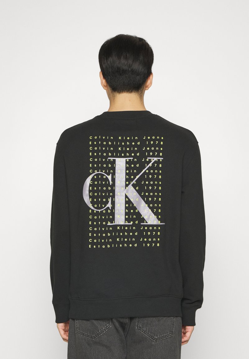 Calvin Klein Jeans Exclusive Multi Graphic Crew Neck Sweatshirt Ck